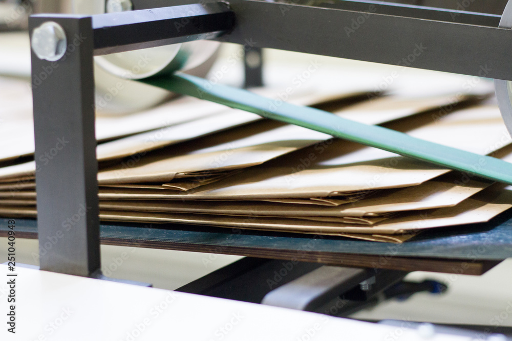 automated paper bags making process Stock Photo | Adobe Stock
