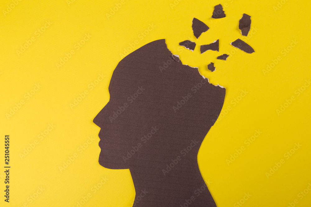 Brain disorder symbol presented by human head made form paper ...