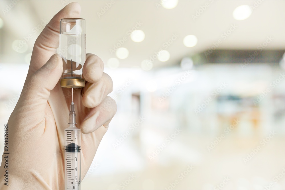 Human Hand with injection Syringe on light background Stock Photo ...