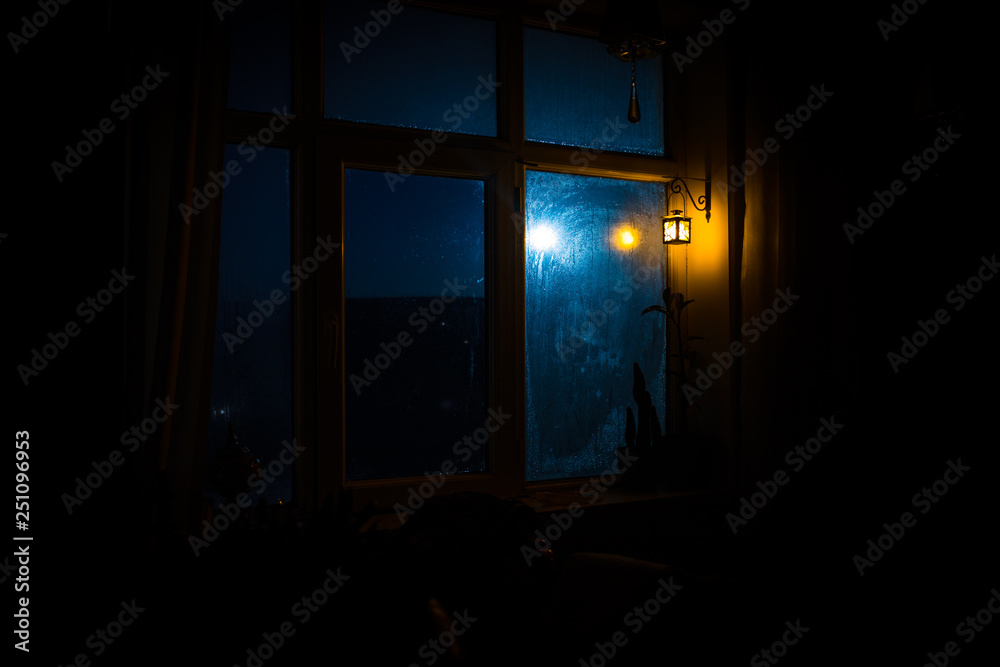 Night scene of stars seen through the window from dark room. Night sky ...