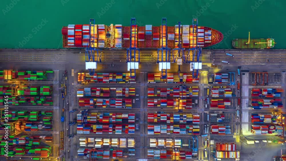 Container cargo freight ship with working crane bridge discharge at ...