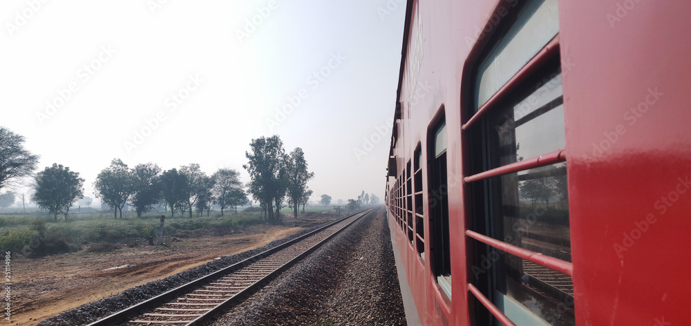 Looking out of the window of a express train of Indian railways with a ...