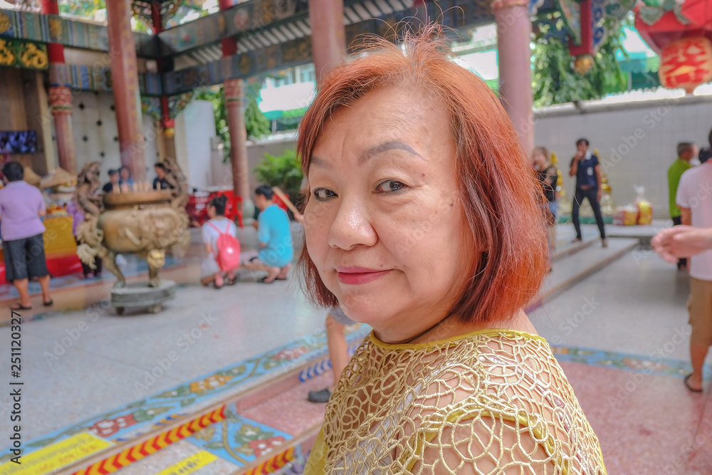 Portrait photo of senior asian women in Tai Hong Kong Shrine at bangkok ...