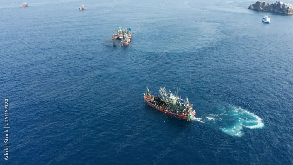 Industrial overfishing - aerial view of a fleet of large fishing ...