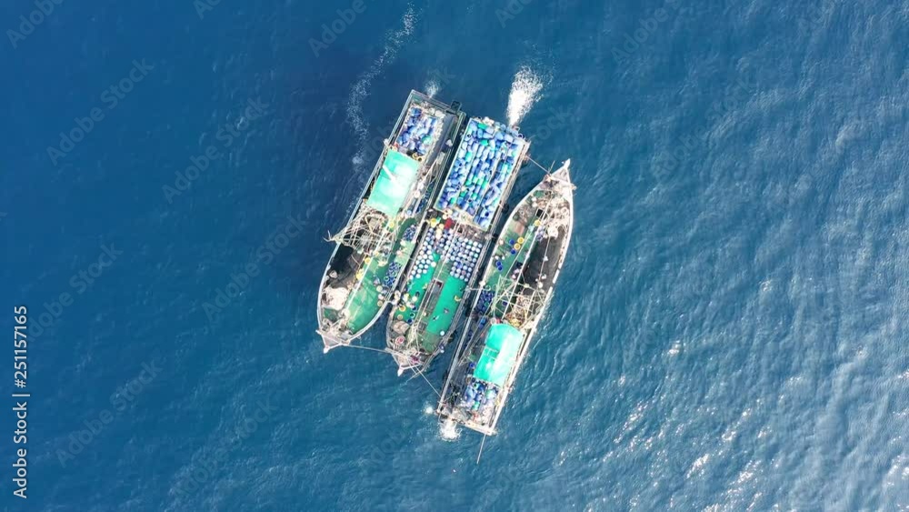 Industrial overfishing - aerial view of a fleet of large fishing ...