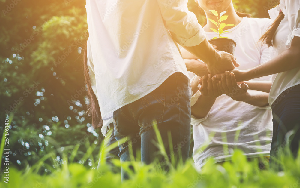 Group of volunteer with sprout for growing. World environment day and ...