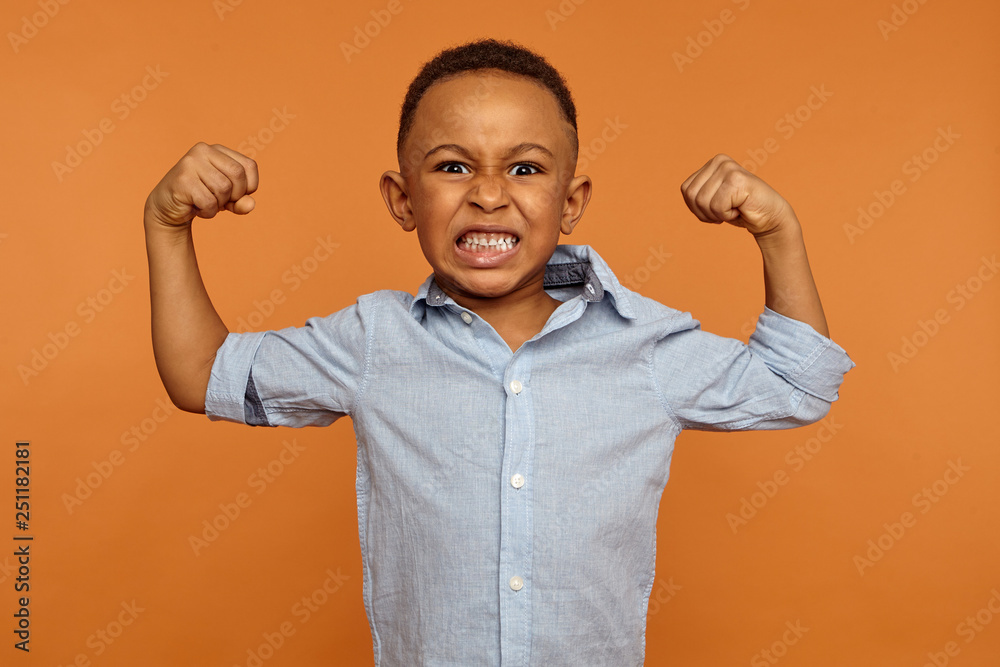 Fierce angry emotional dark skinned male expressing fury or rage ...