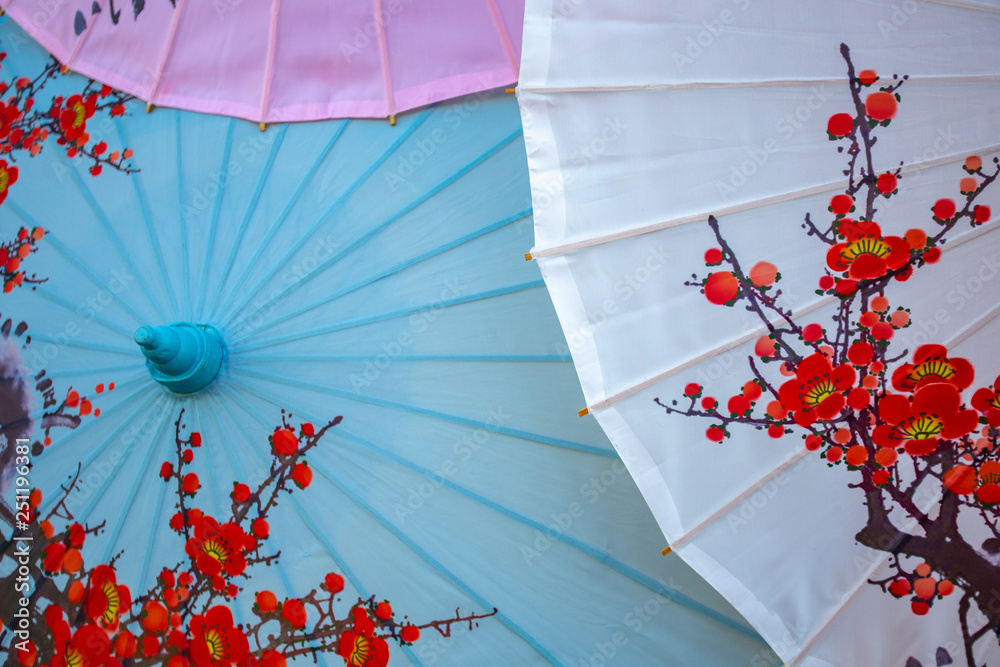 Ancient Japanese umbrellas placed in multicolored patterns,Old wooden ...