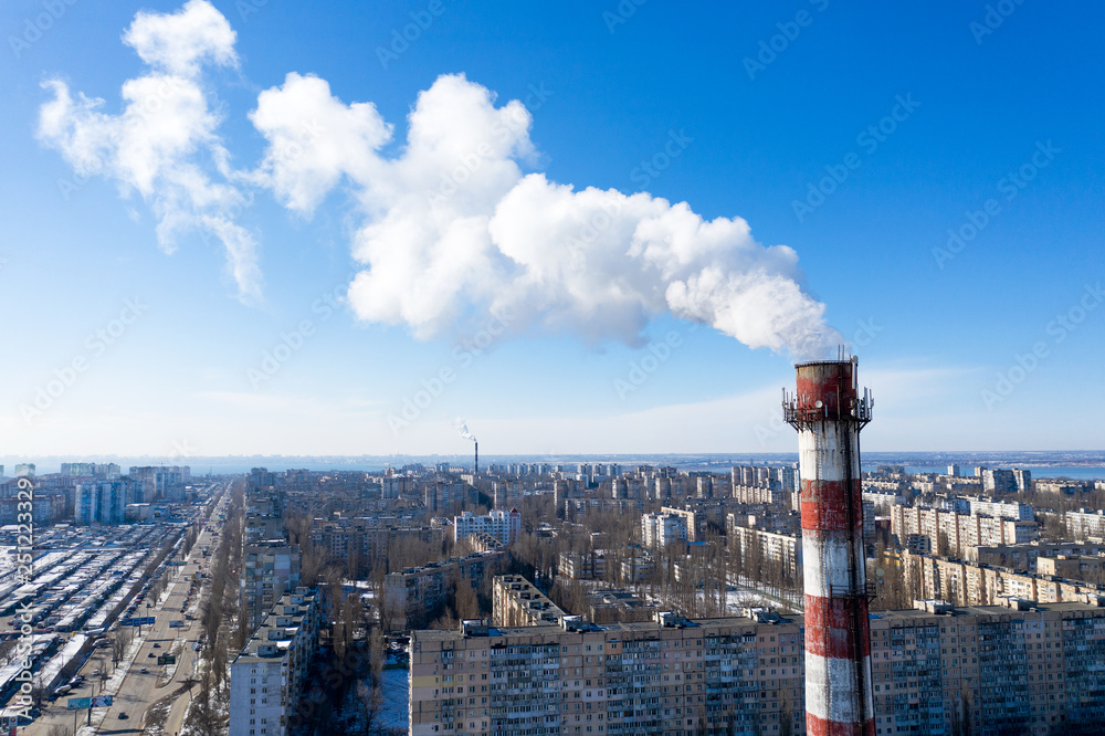 Air pollution, factory pipes, smoke from chimneys on sky background ...