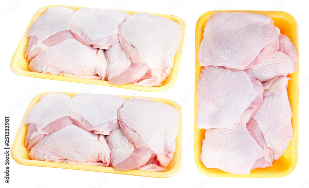 Raw chicken in yellow plastic tray isolated on white background, top ...