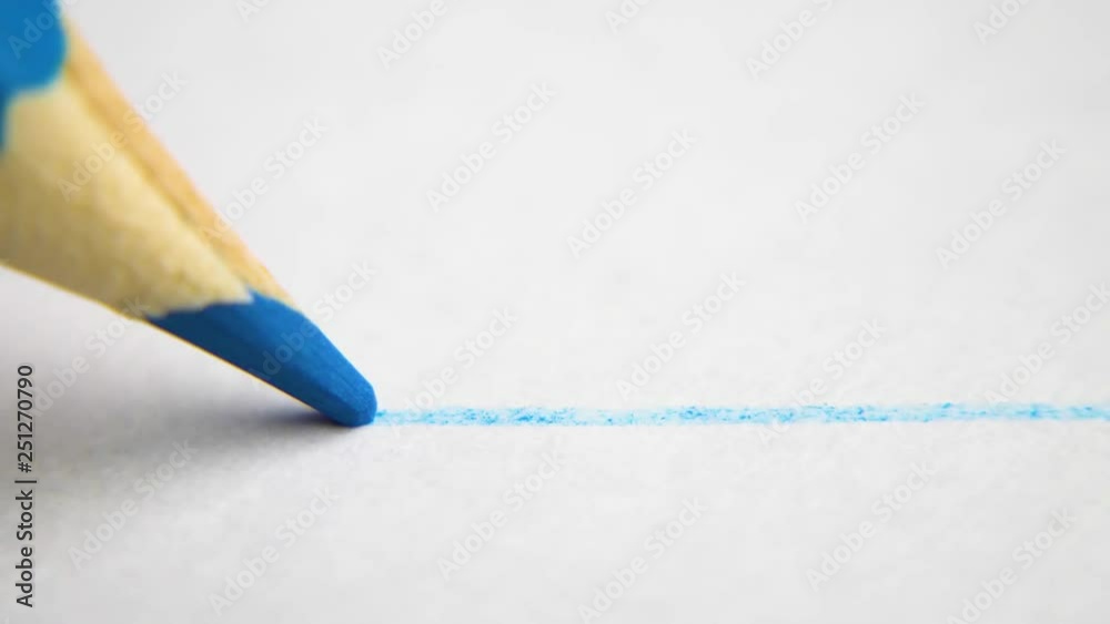 extreme close up of architect or artist draws a line in pencil ...