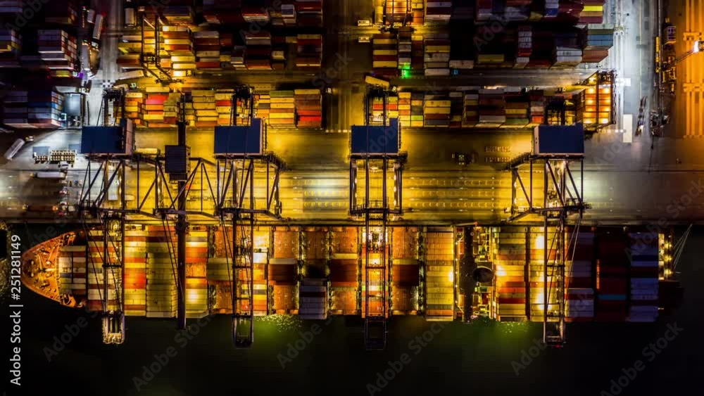 Container cargo freight ship with working crane bridge discharge at ...