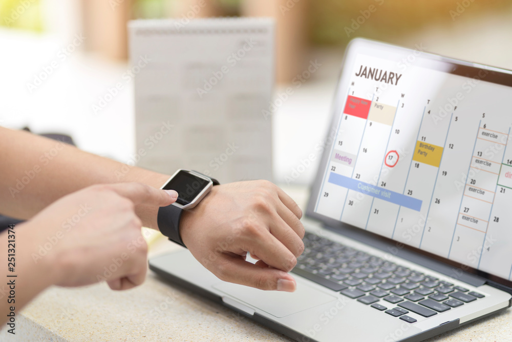 Male hand with smart watch on wrist. Planning agenda and schedule using ...