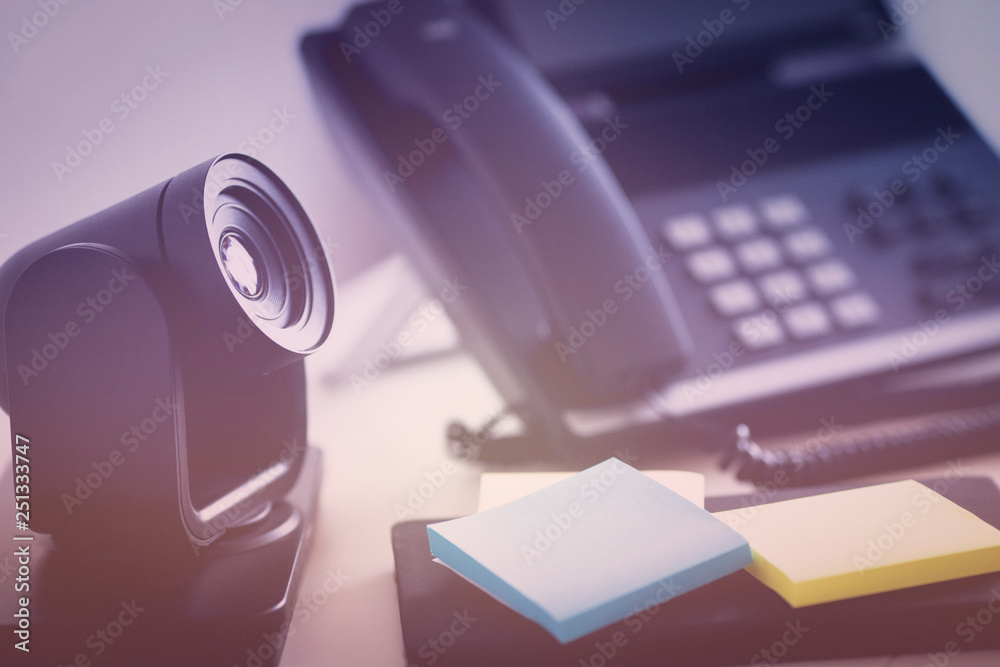 Video camera for business meetings, laptop and IP phone on the office ...