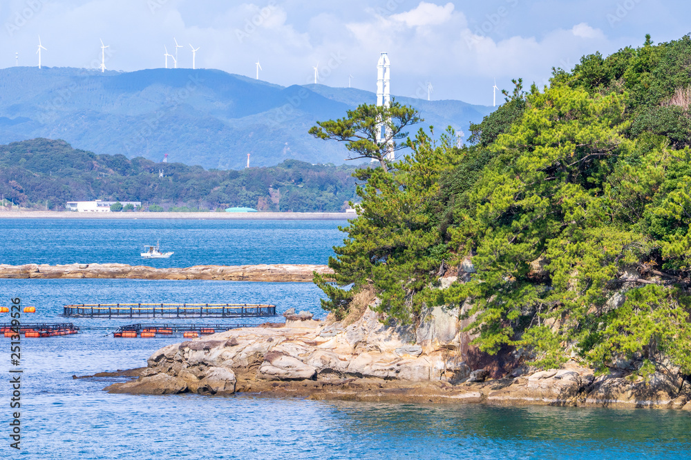 Many small islands over the blue ocean in sunny day, famous Kujukushima ...