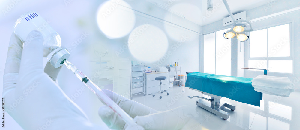 Hand holding syringe and medicine vial prepare for injection in ...