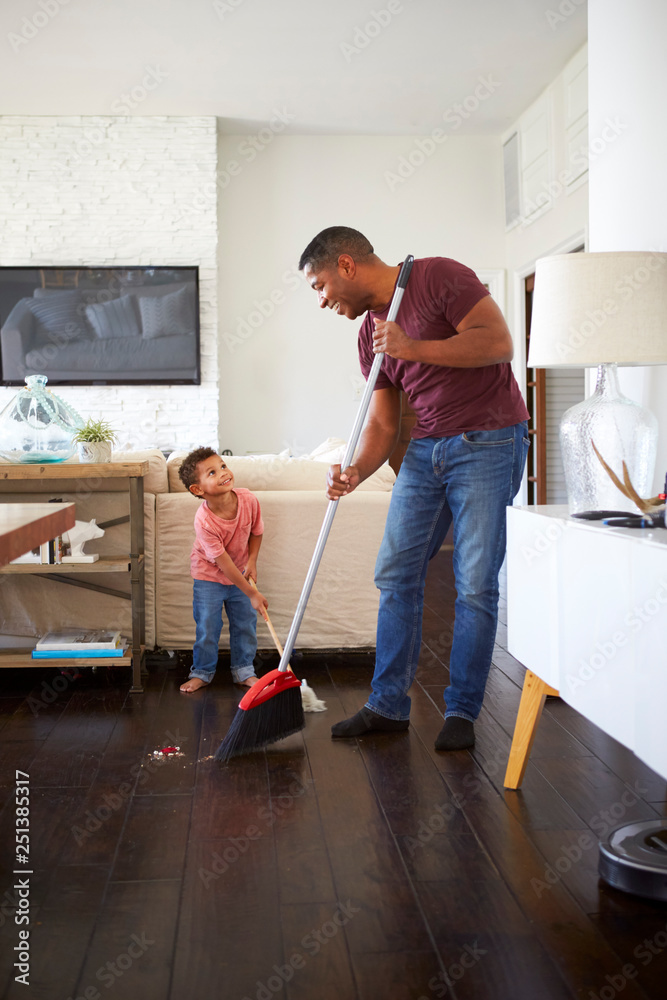 Grandfather and his three year old grandson looking at each other while ...