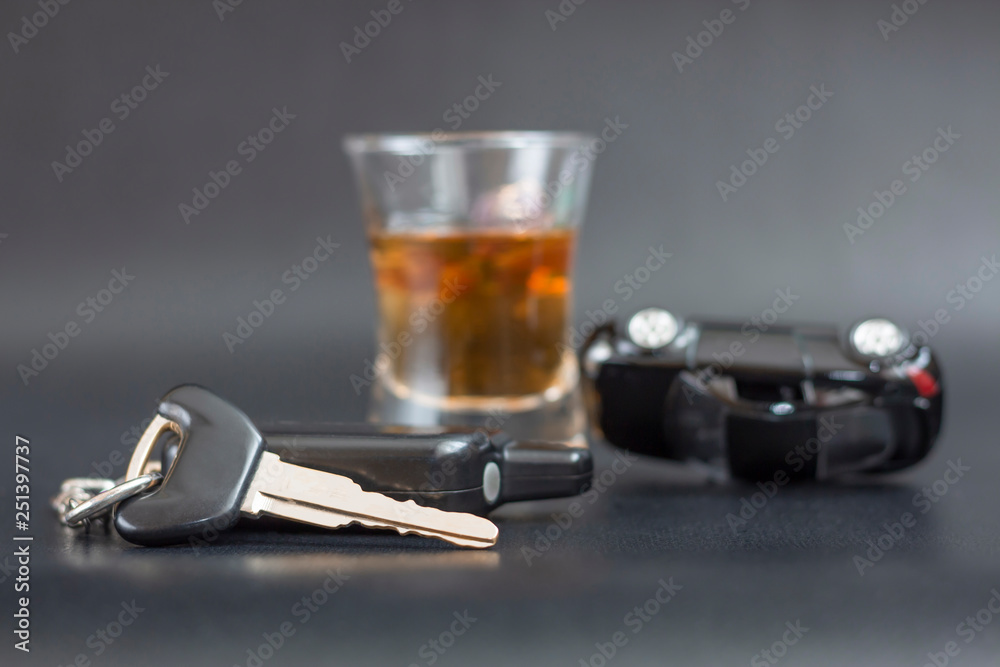 Drunk driving concept, accident. Auto key, glass of whiskey alcohol ...