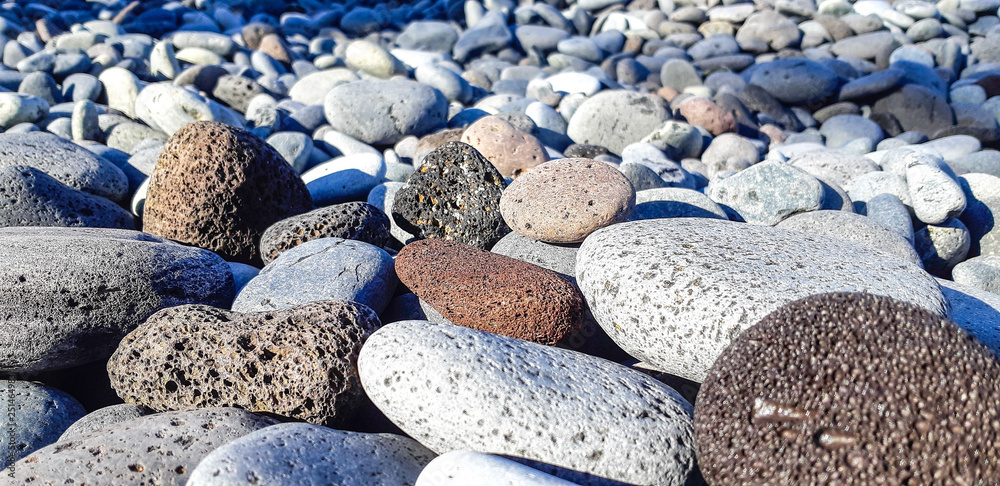 Sea pebbles closeup. Background of beach pebbles of different shape and ...