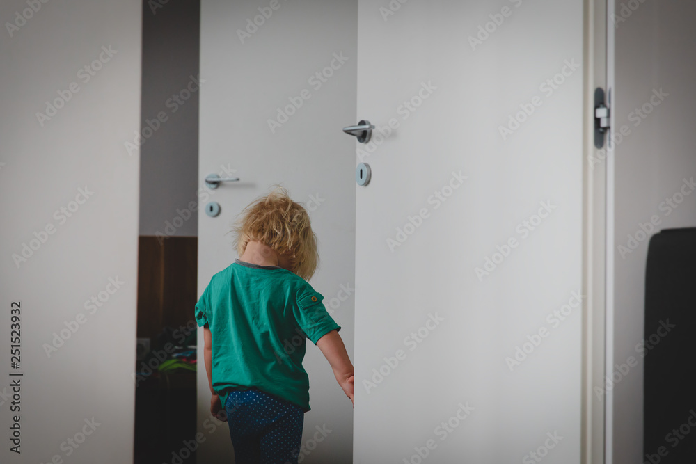sad little girl going out and closing doors, child offence Stock Photo ...