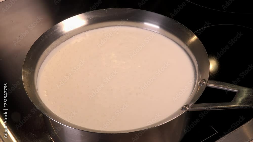 Cook natural organic milk, boil the milk in pots, milk that is about to ...