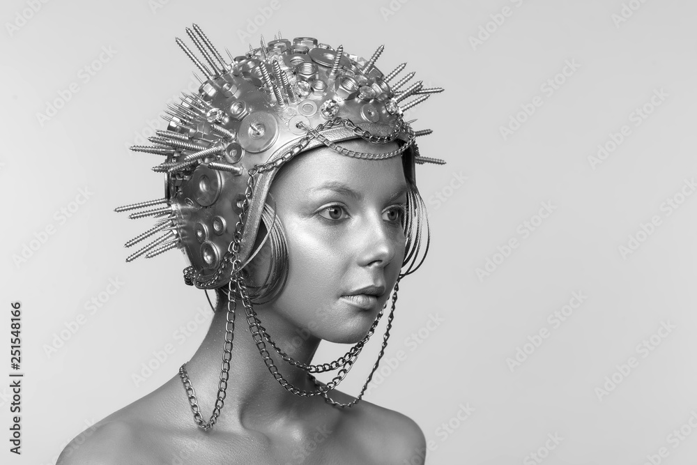 Futuristic woman in metal helmet with screws, nuts and chains Stock ...