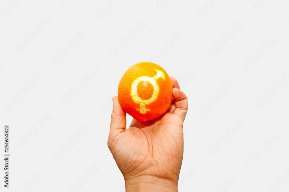 Foto de Gender equality. Orange with the sign of gender equality in the ...