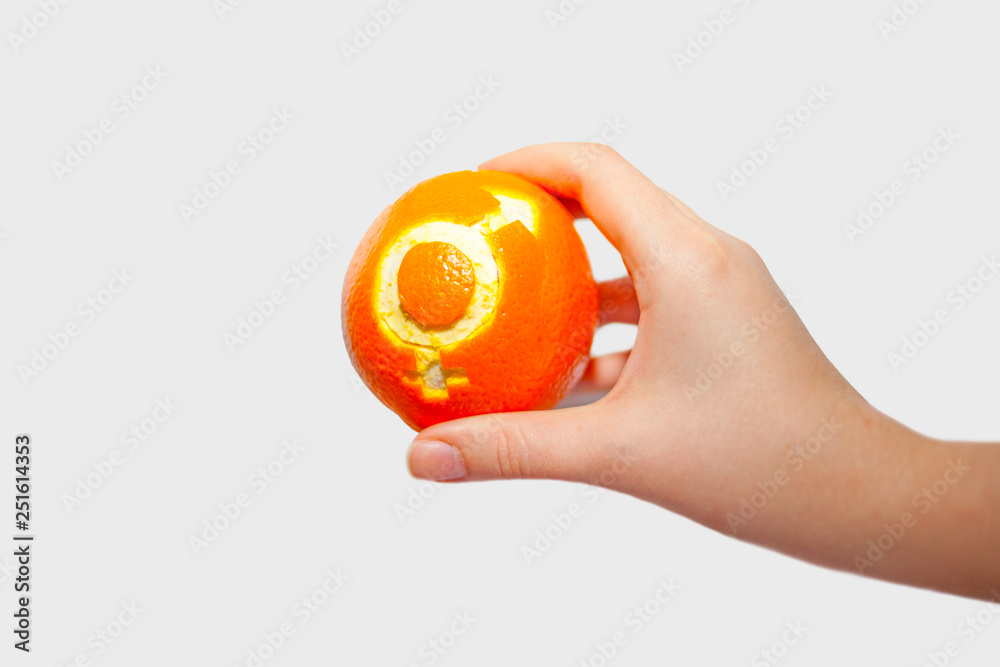 Gender equality. Orange with the sign of gender equality in the hand of ...