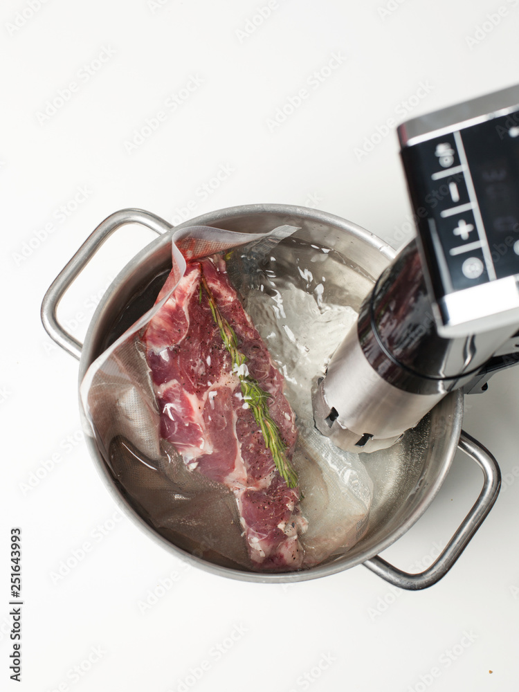 Sous vide cooking in pot Stock Photo | Adobe Stock