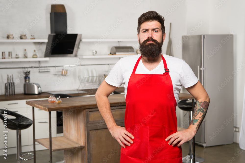 How to turn cooking at home into habit. Man bearded hipster red apron ...