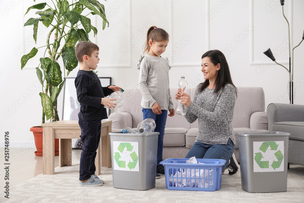Family sorting garbage at home. Concept of recycling Stock Photo ...