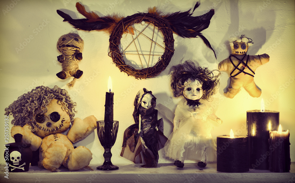 Voodoo ritual with scary dolls, black candle and pentagram with ...