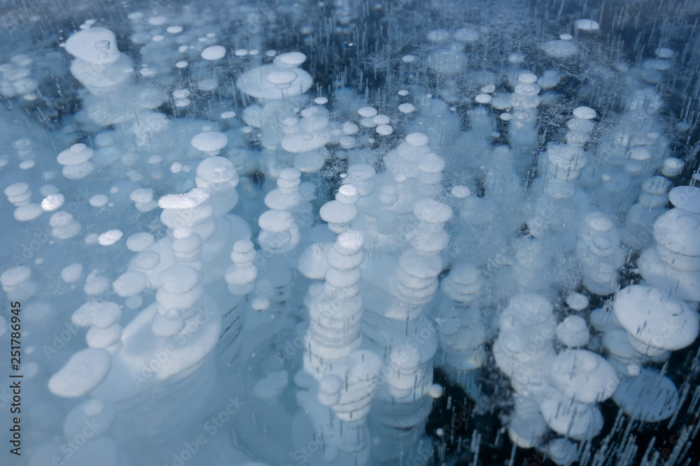 Methane bubbles trapped in thick frozen surface of Lake Baikal, Russia ...