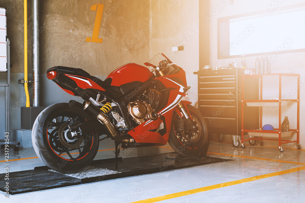 closeup sport motorcycle in repair station and body shop with soft ...