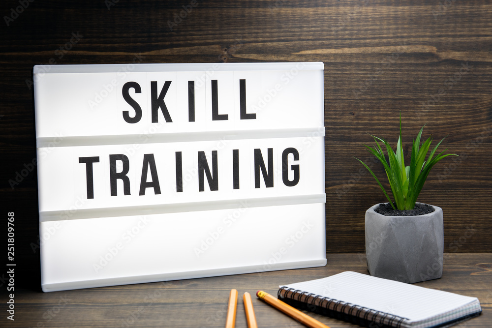 Skill Training concept. Text in lightbox. Wooden office table Stock ...