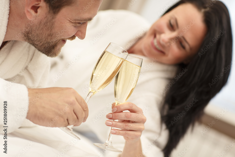 Selective focus of glasses with champagne in hands of cute couple. Love ...