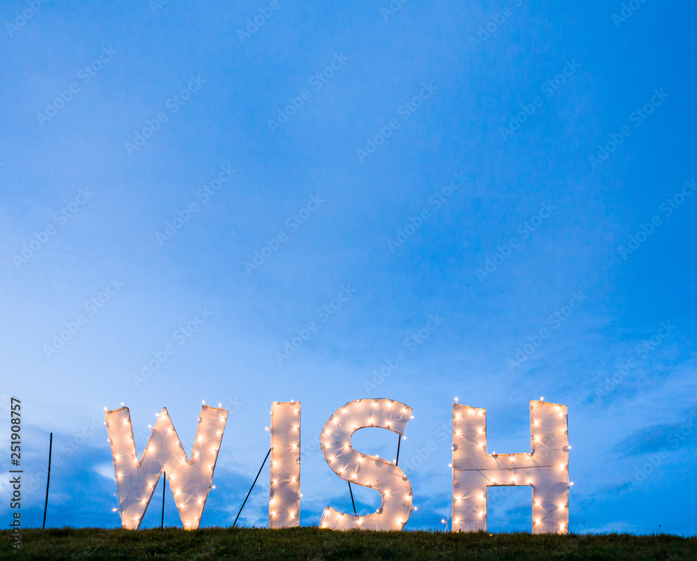 Illuminated lighted wish sign. Aspirations hope concepts background ...