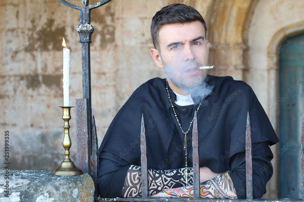 Sexy priest with a rebel attitude Stock Photo | Adobe Stock