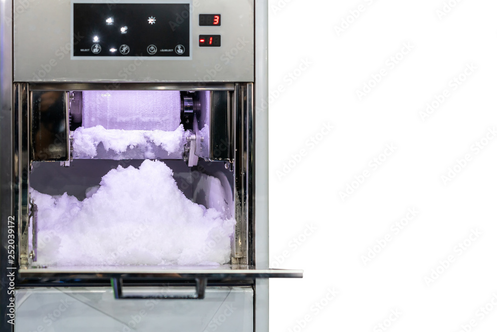 Close up ice flake or snowflake during making from modern and automatic ...