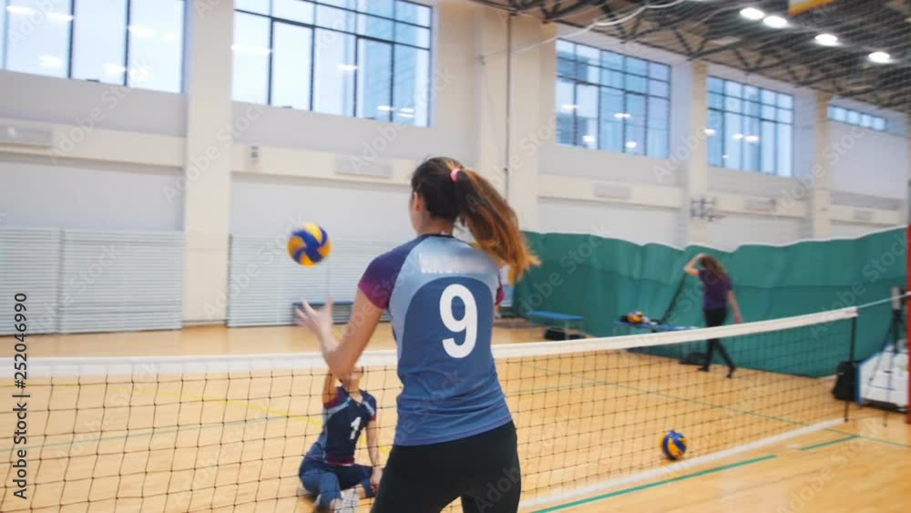 Sports for disabled people. A young woman sitting on the floor and ...