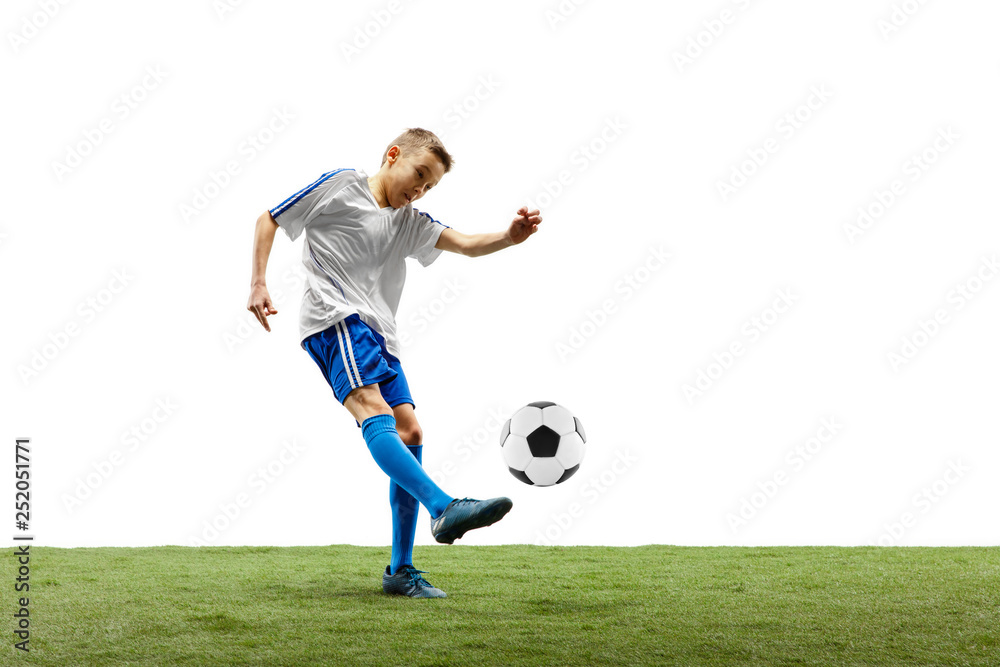 Young boy with soccer ball running and jumping isolated on white studio ...