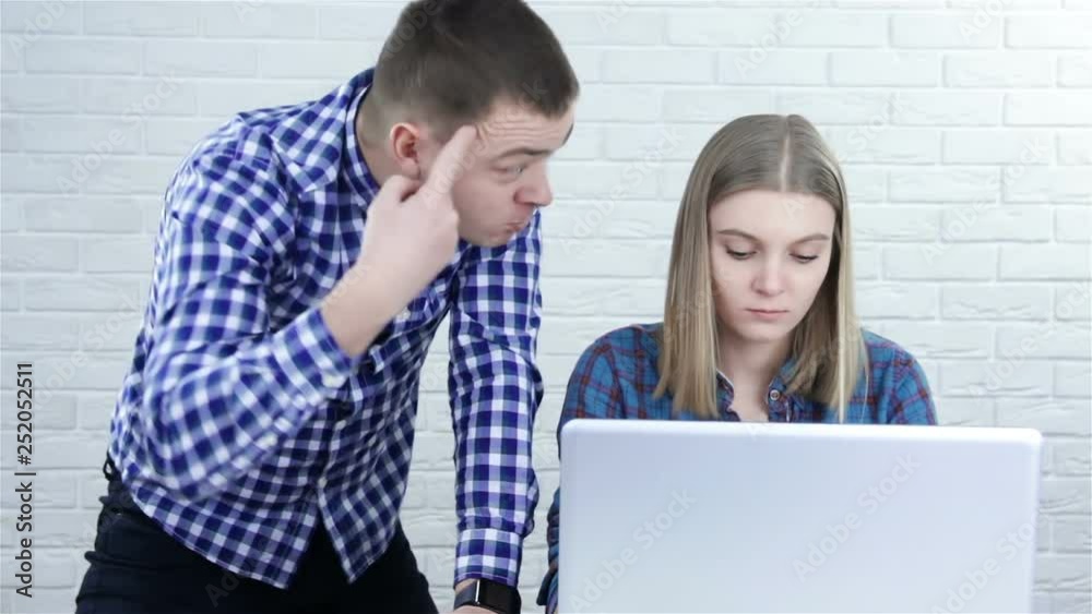 Angry boss yelling at his young employee, she is stressed and feeling ...