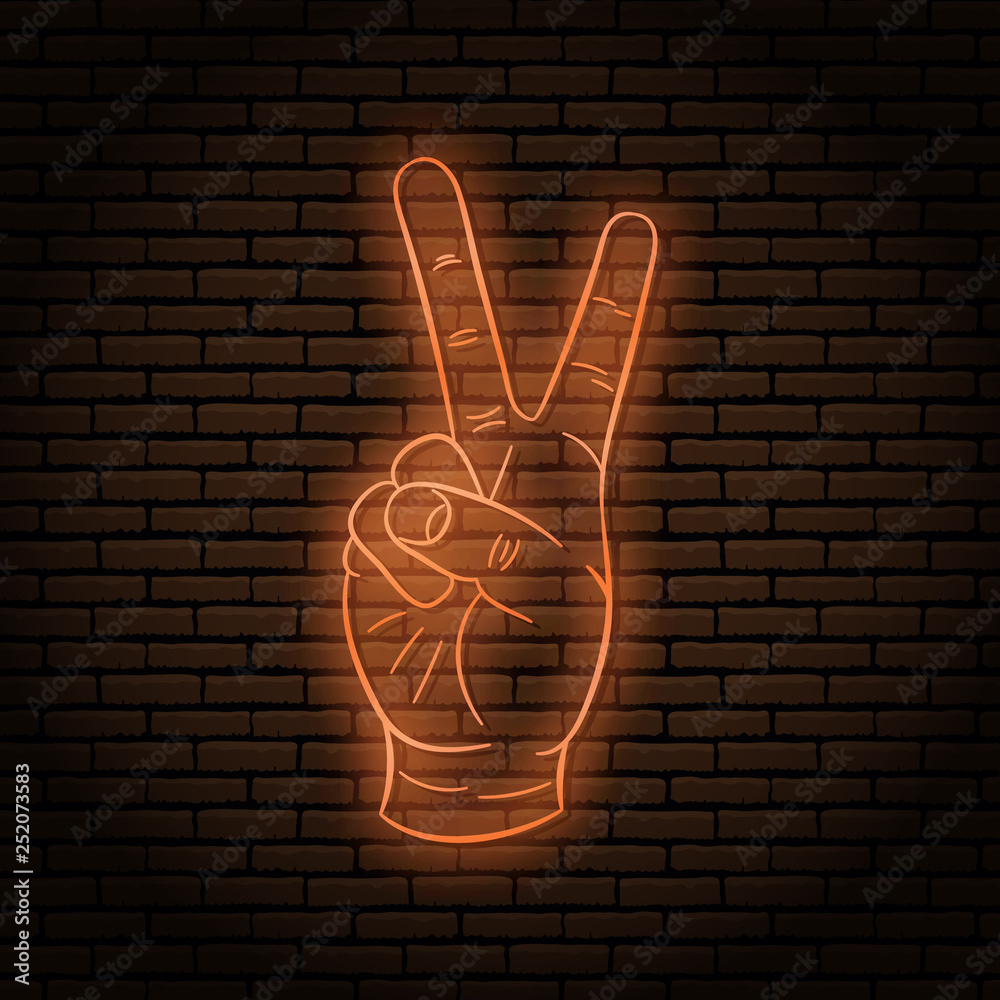 Neon sign with an orange glow. Hand gesture, two fingers, shows peace ...