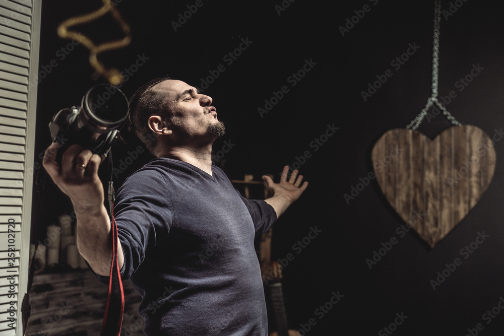 the man photographer spread his hands in different directions. holding ...