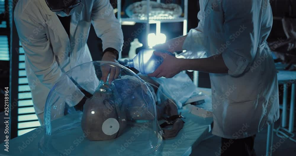 Scientists physicians enliven the alien creature in the laboratory of ...