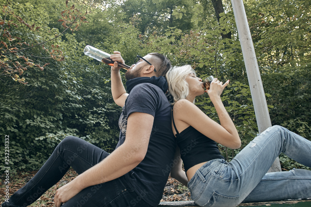 Alco addiction concept. Depressed and hopeless couple sitting after ...