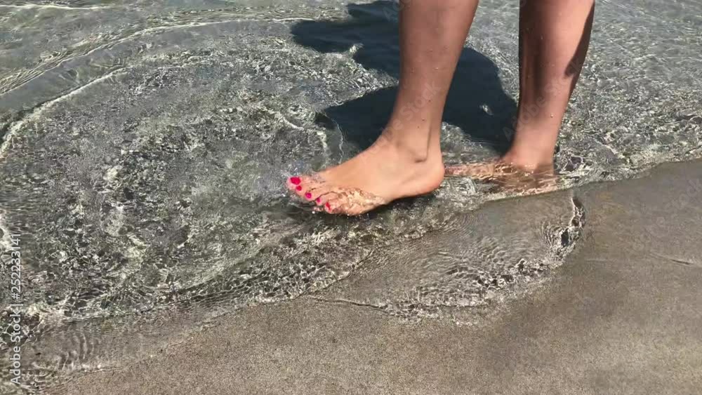 woman foot in the sea, man's feet in the sea, clear sea, clean ...