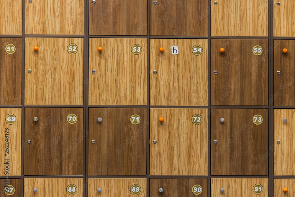 Brown wooden safety box row with symbols and numbers - locker for ...