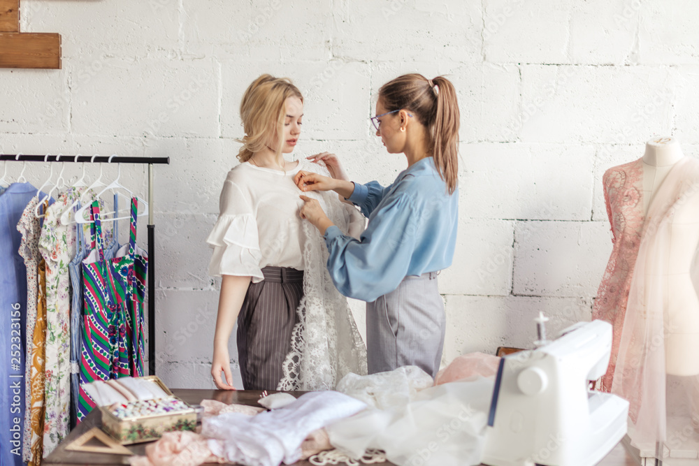 Talanted female clothing designer is selecting a suitable fabric for a ...