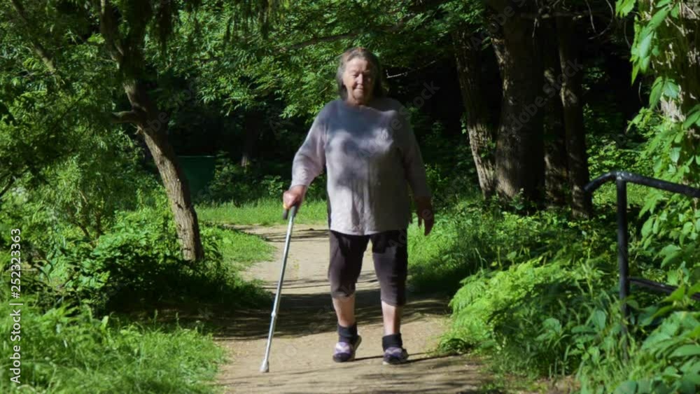 friendly, grandmother walk with cane on road. old person leaning on a ...
